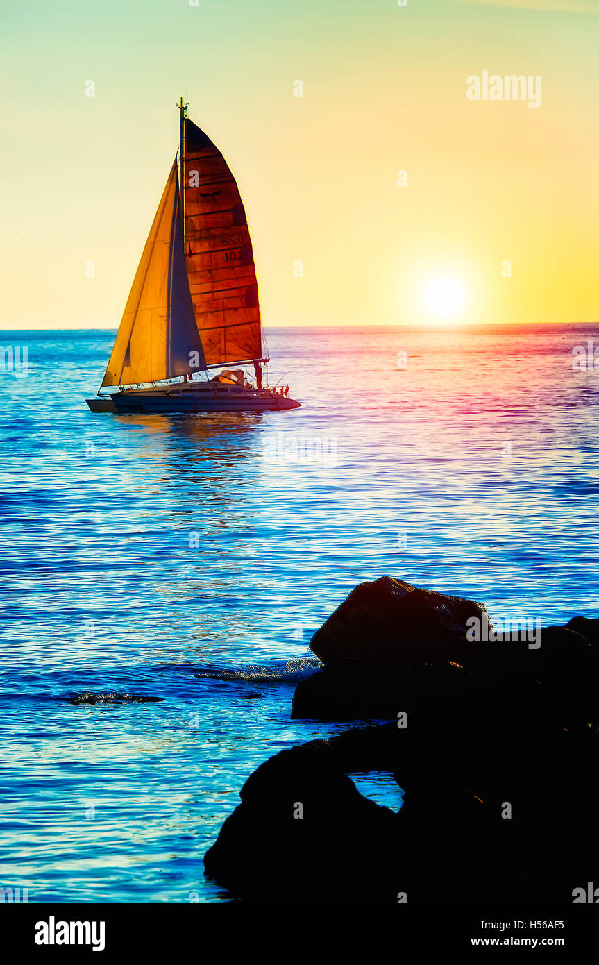 sailboat at sunset Stock Photo - Alamy