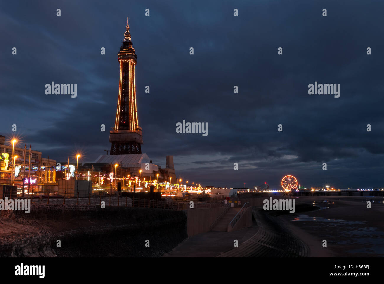 Blackpool Tower and beach front, lights and beach in the early evening ...
