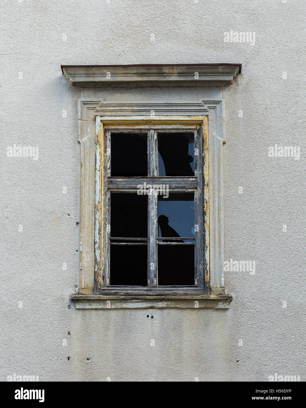 Vandalized window on a building with bullet marks Stock Photo - Alamy