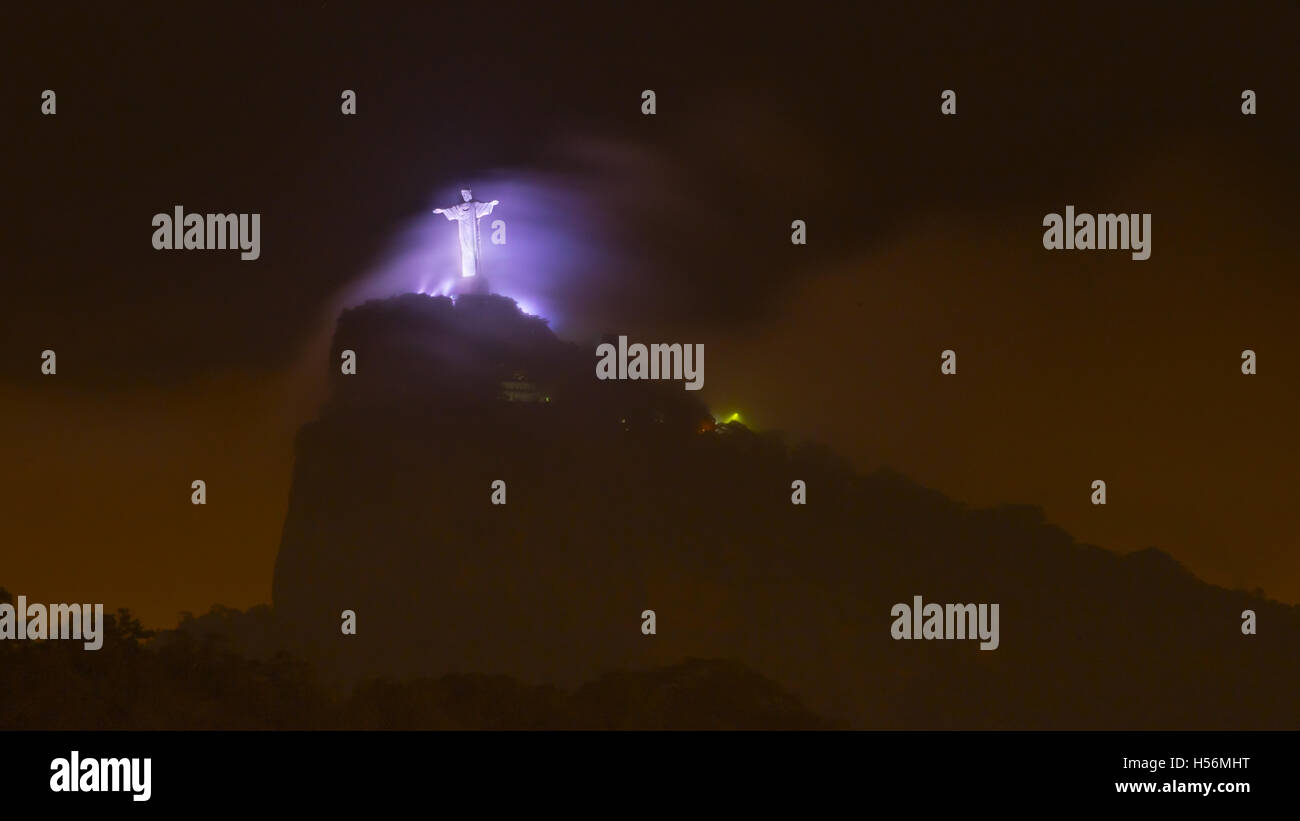 Christ the Redeemer statue led up in the mist on the top of mountain at ...