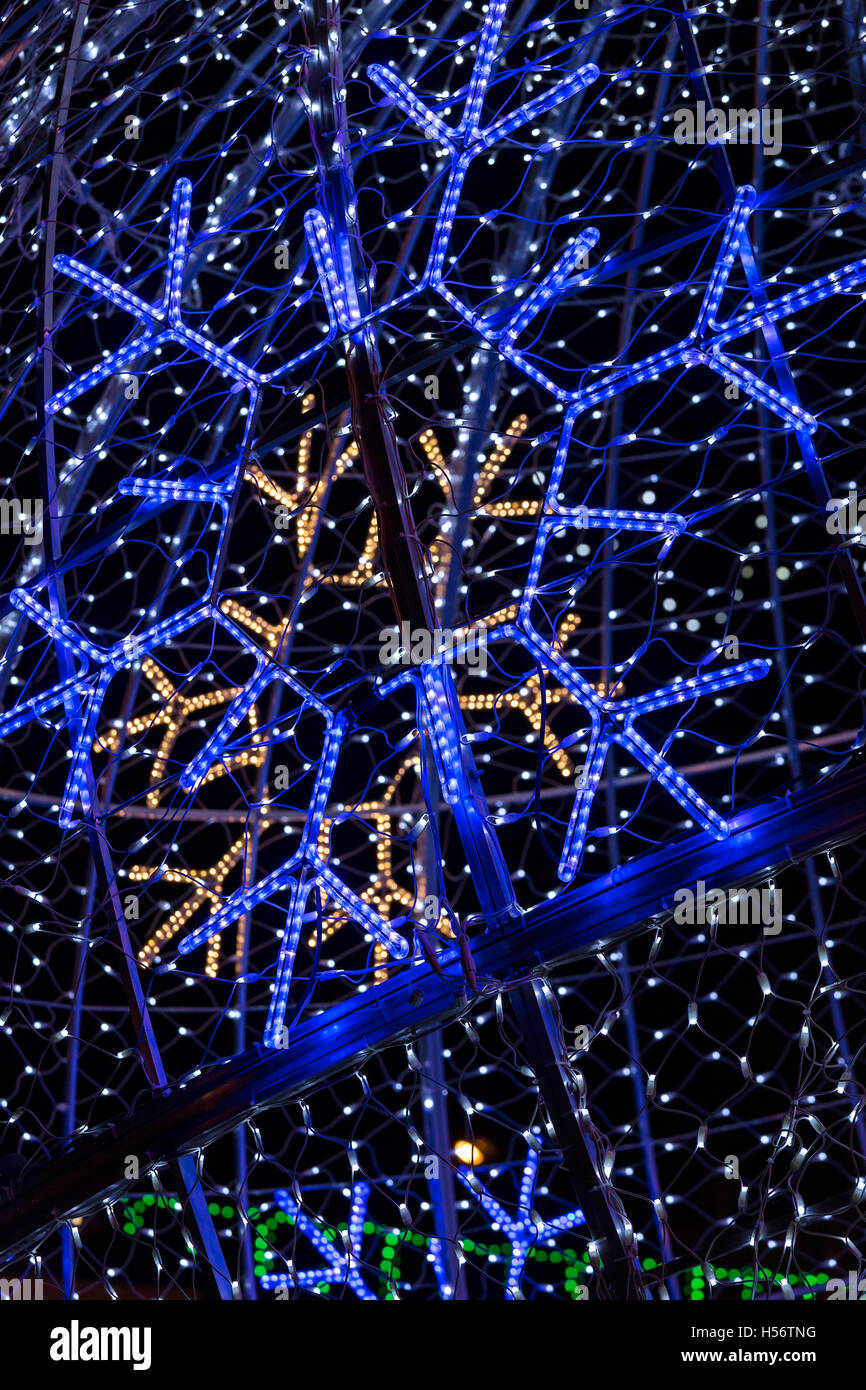 winter holiday festive street illumination in blue made by LED rope ...