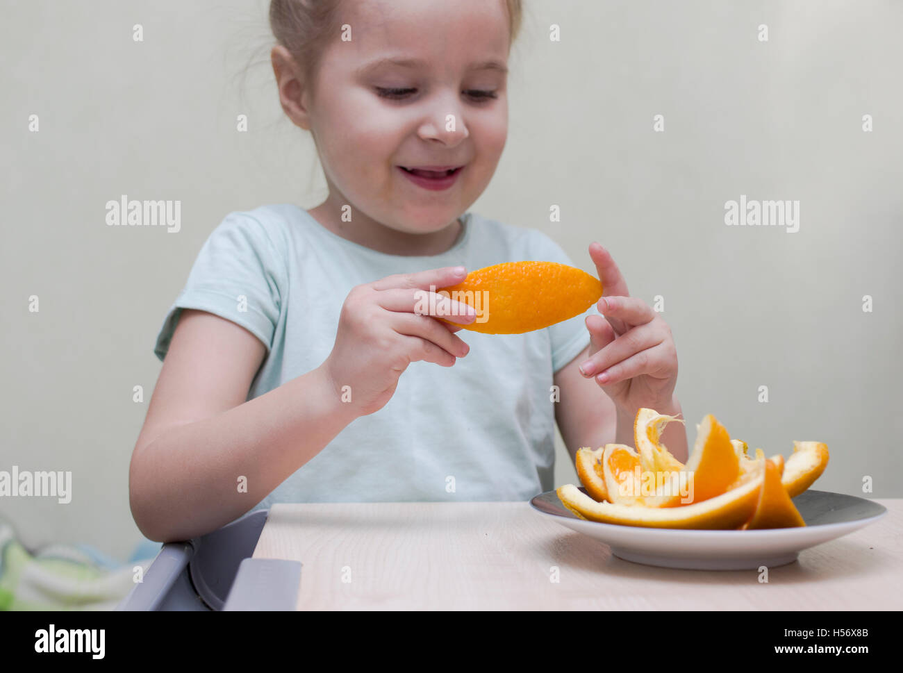 Girl With Orange Stock Photo - Alamy