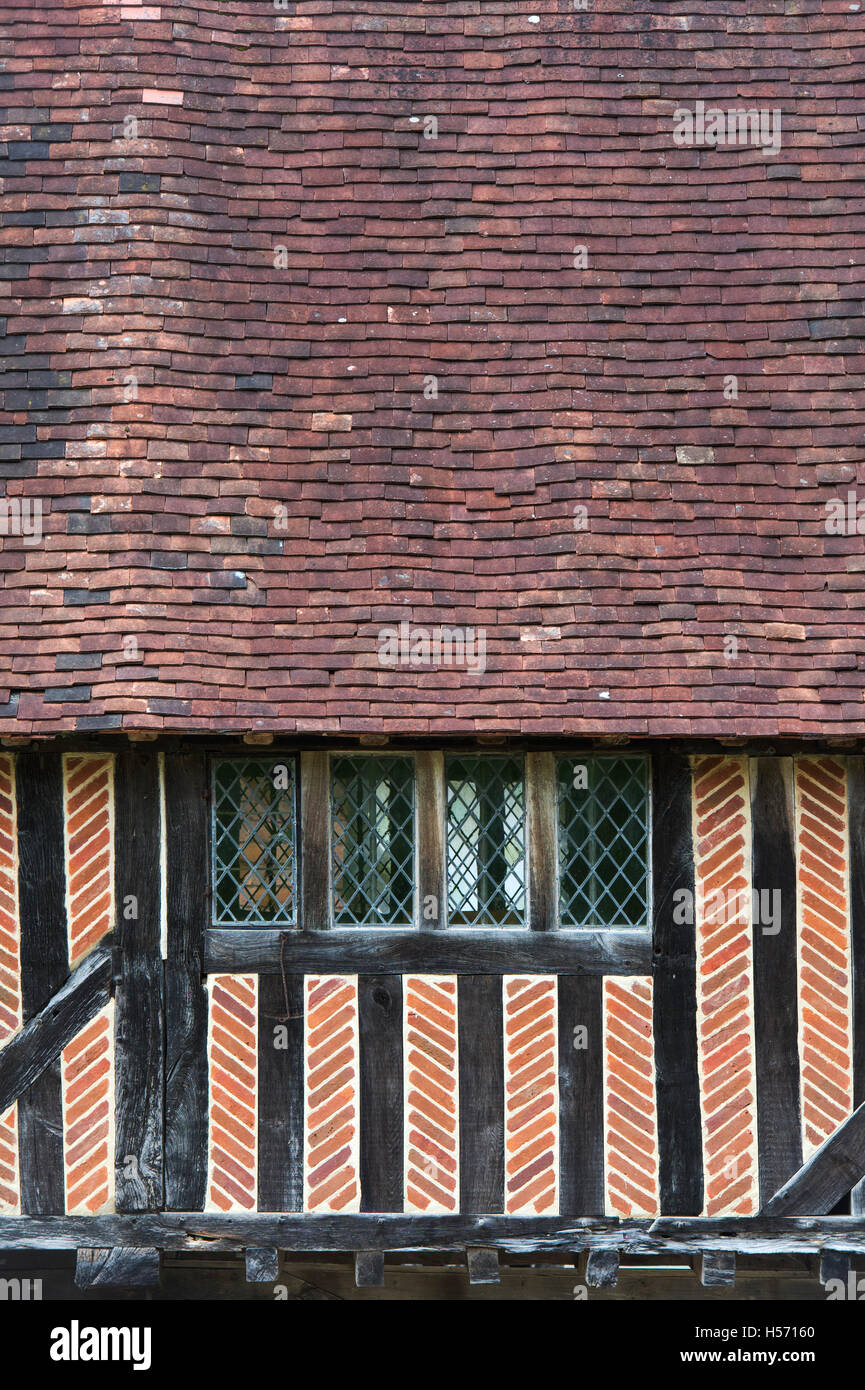Timber framed and brick market hall building with leaded windows detail ...