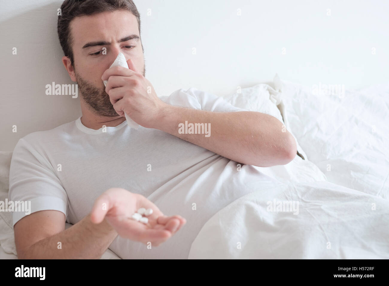 Sick handsome young man taking hi-res stock photography and images - Alamy