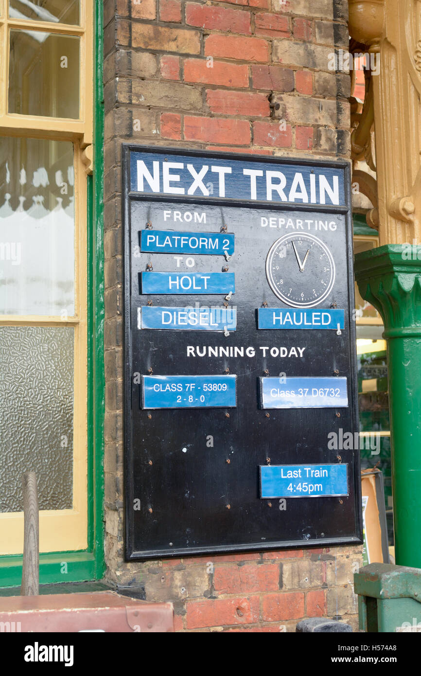 Next Train sign with clock showing arrival on Sheringham Railway ...
