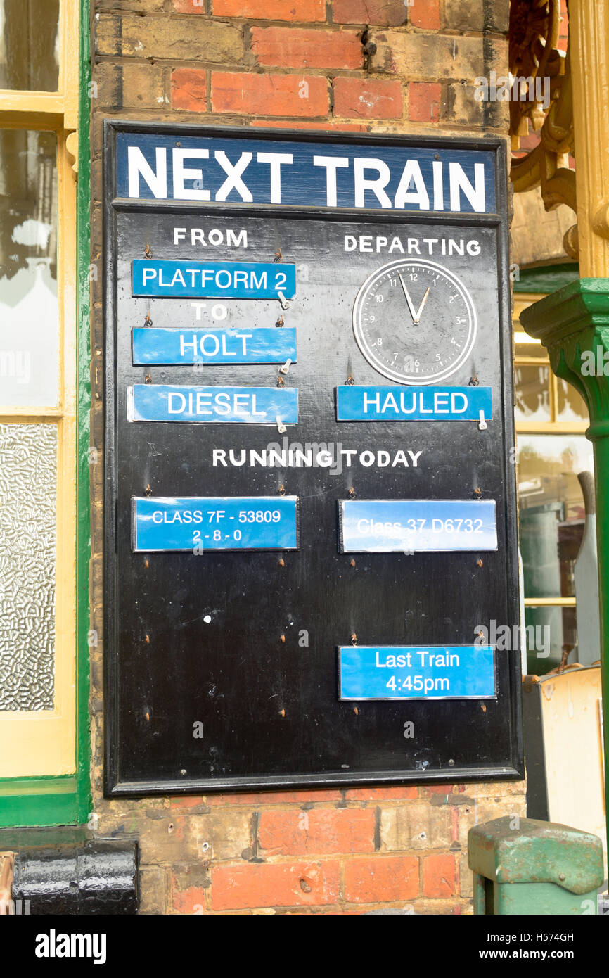 Next Train sign with clock showing arrival on Sheringham Railway ...