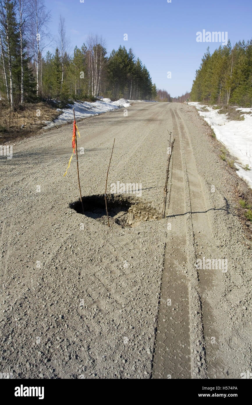 pothole damage on road after winter, Finland Stock Photo - Alamy