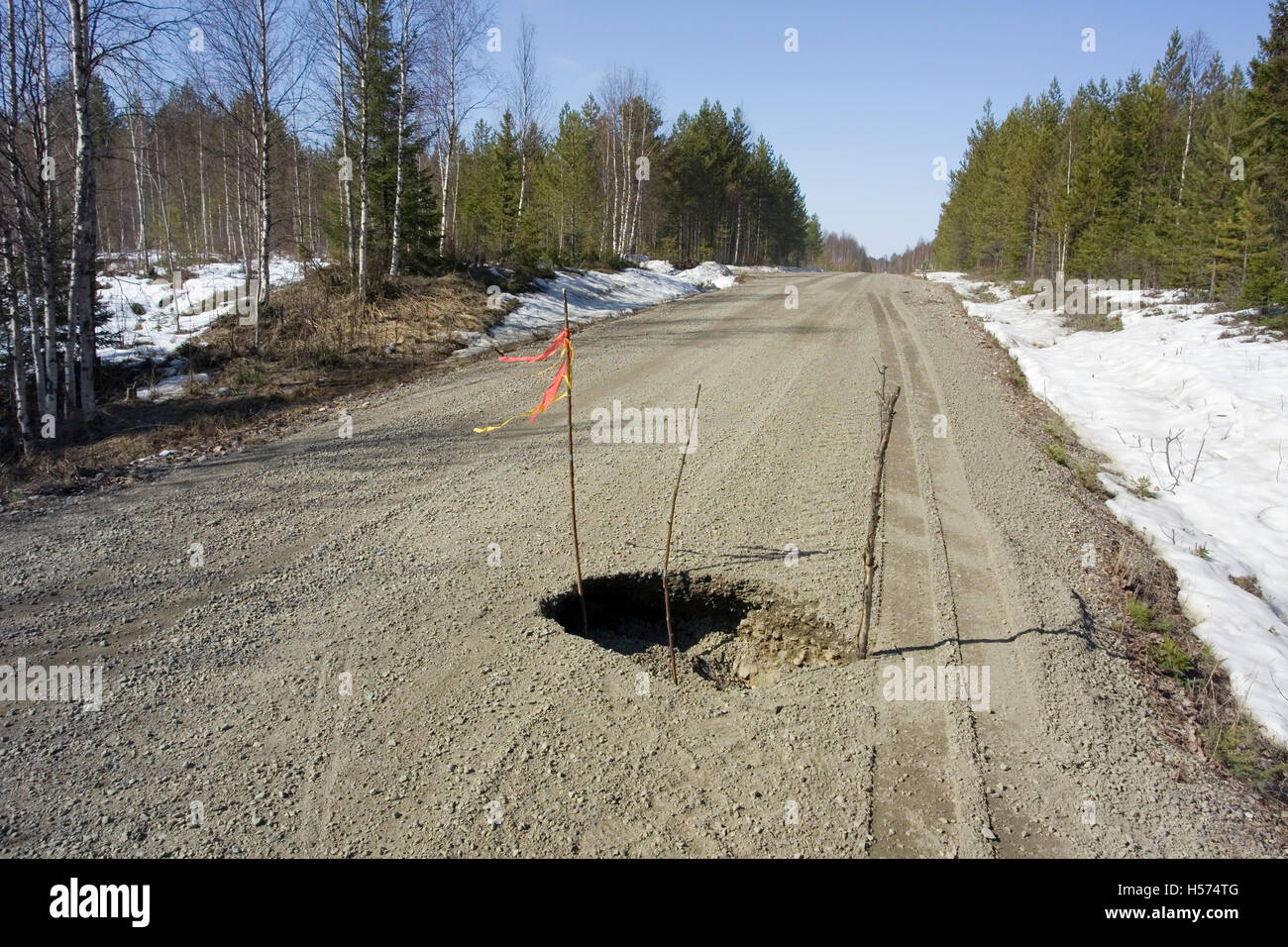 pothole damage on road after winter, Finland Stock Photo - Alamy