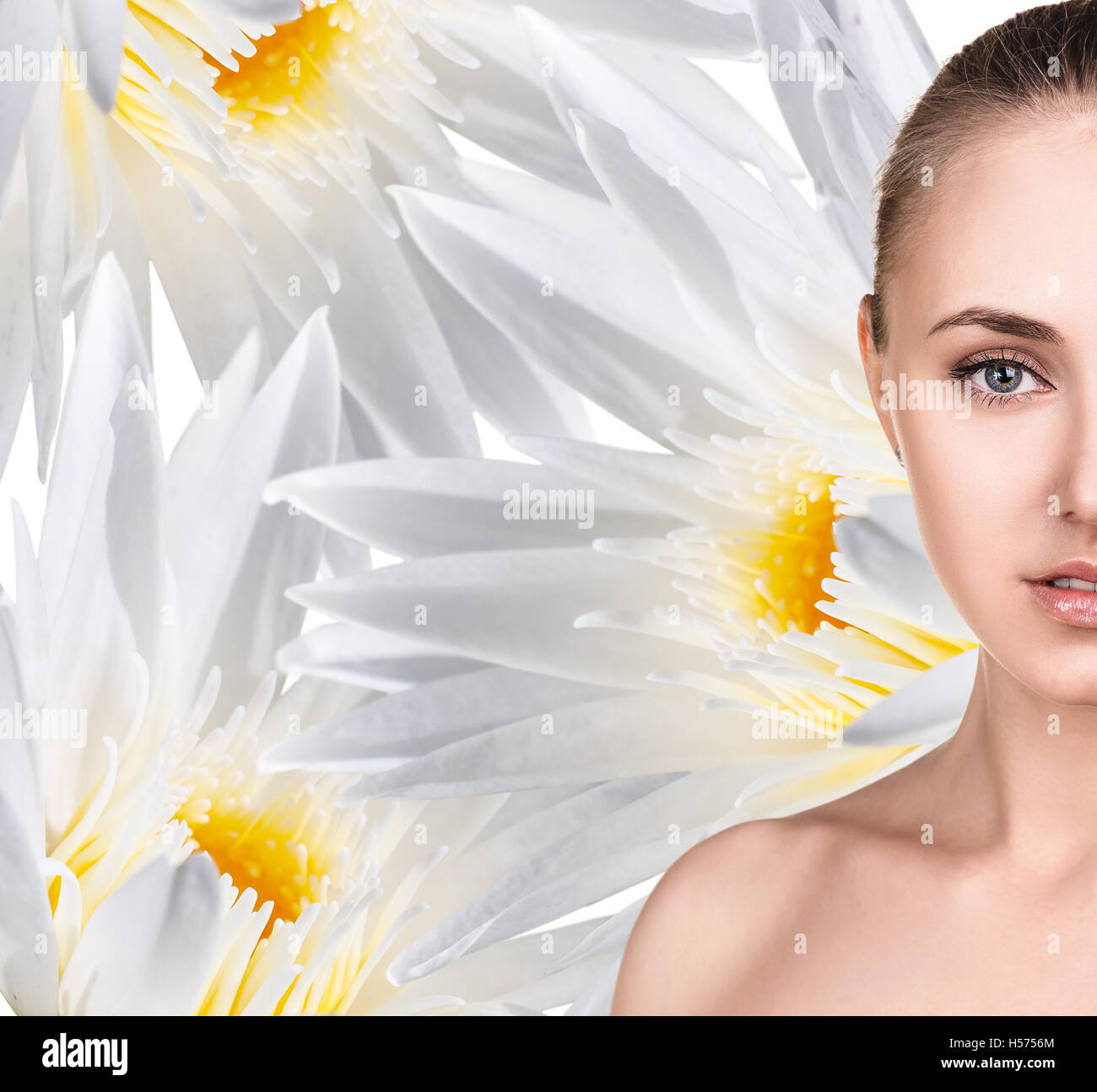 Beautiful woman half-face near white lotus flower Stock Photo - Alamy