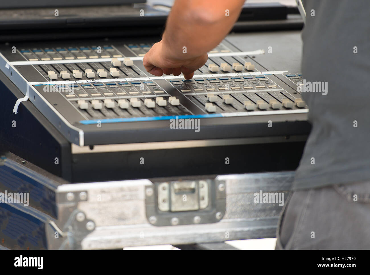 Sound engineer working on mixer in outdoor Stock Photo - Alamy