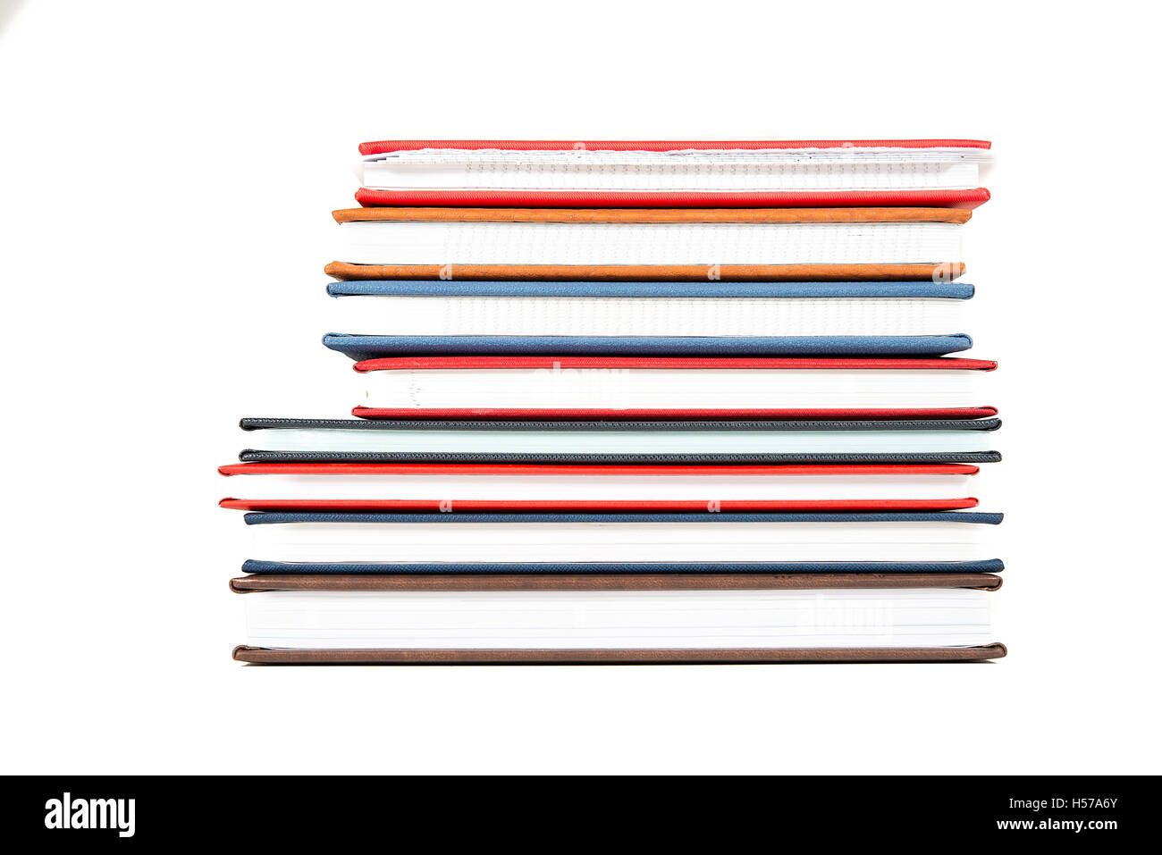 Stack of diaries on white background Stock Photo - Alamy