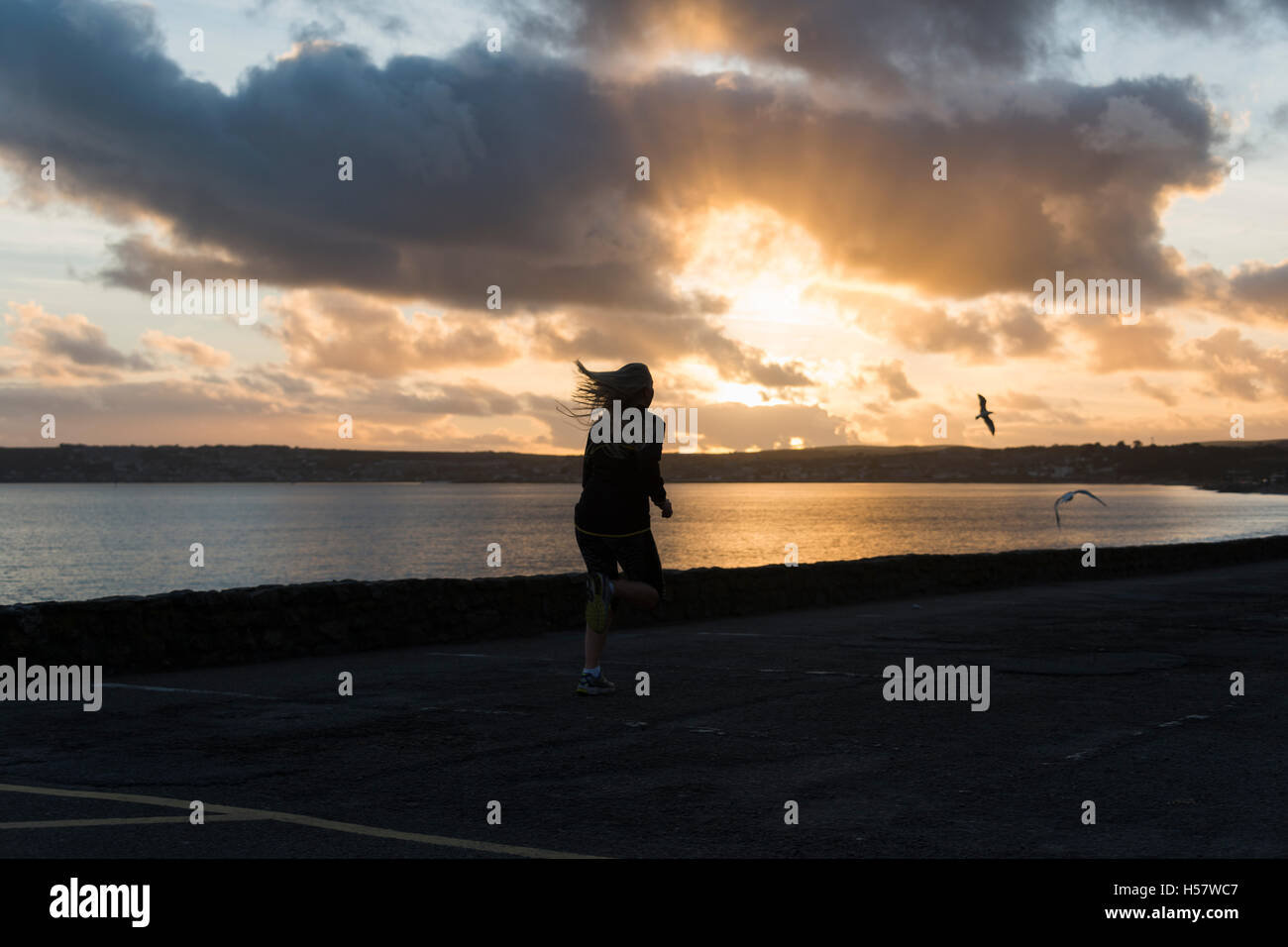Run with something hi-res stock photography and images - Alamy
