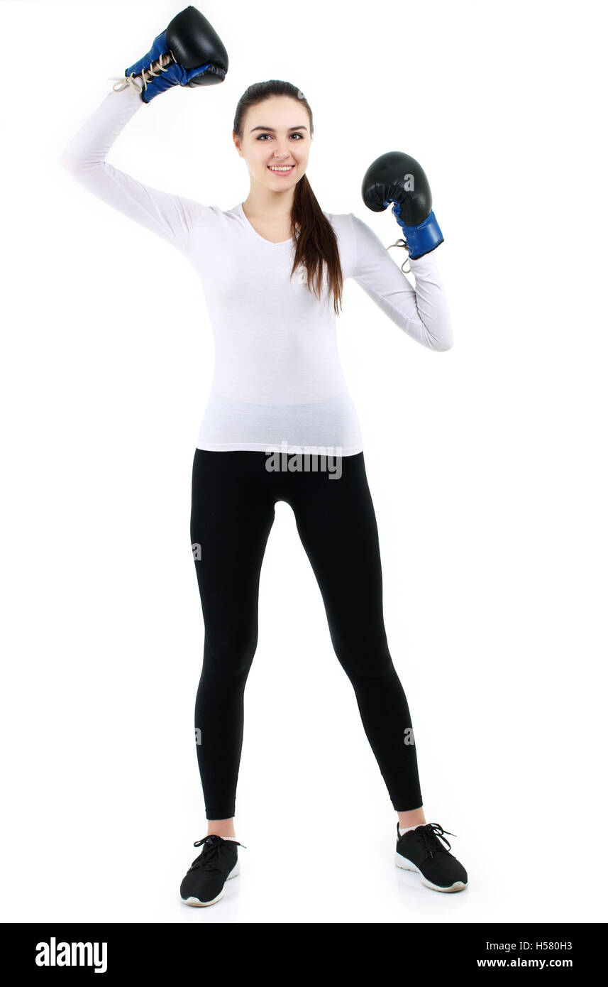 Full length portrait of a cheerful female boxer raising hands over head ...