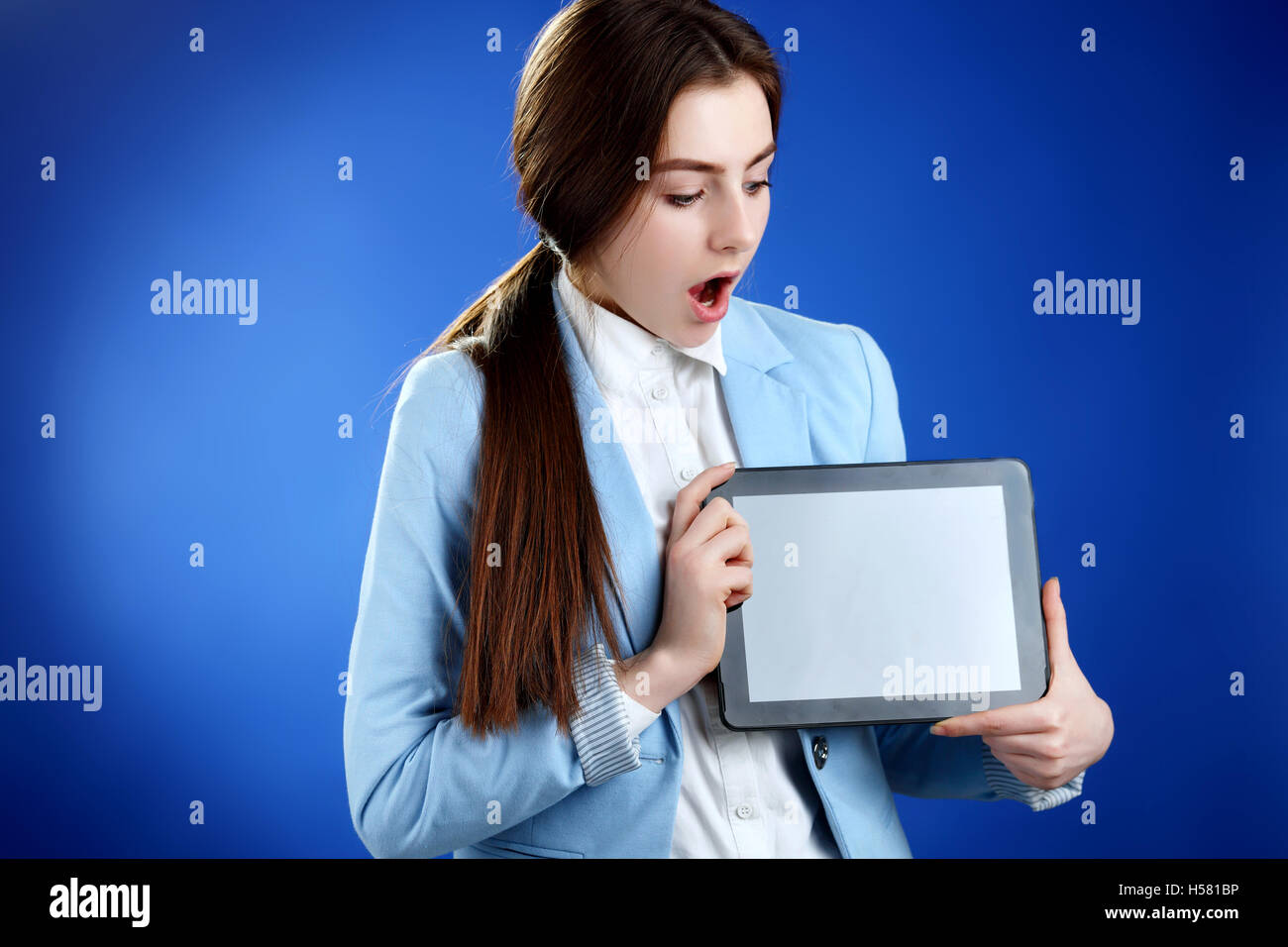 Portrait of a smiling Young girl holding laptop computer Stock Photo ...