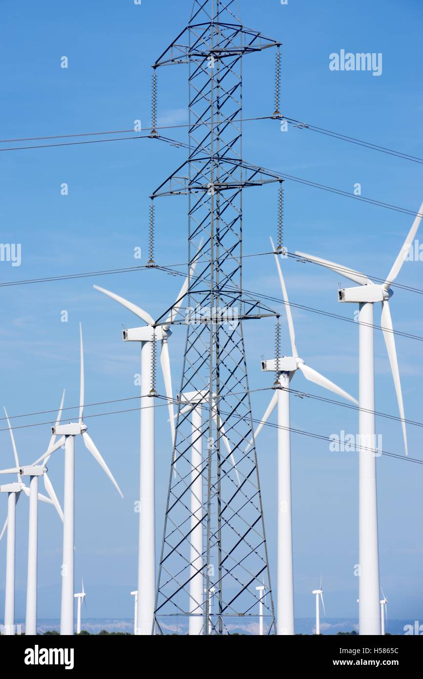 windmills for removable energy production and pylon Stock Photo - Alamy