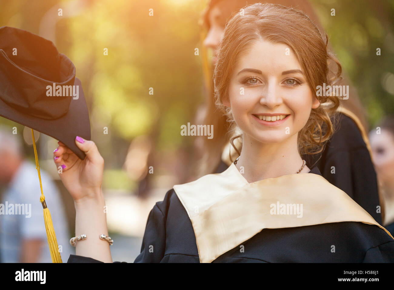 Portrait of graduated student on university campus Stock Photo - Alamy
