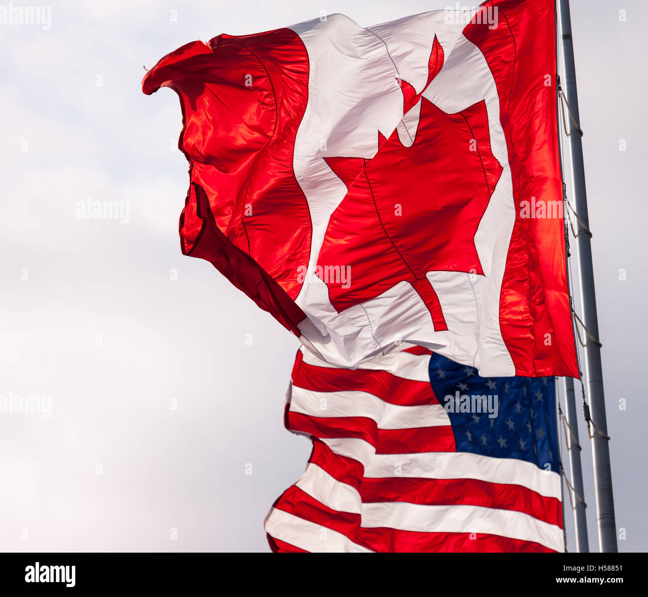 The Canadian and the American Flag fly beside each other in Sarnia ...
