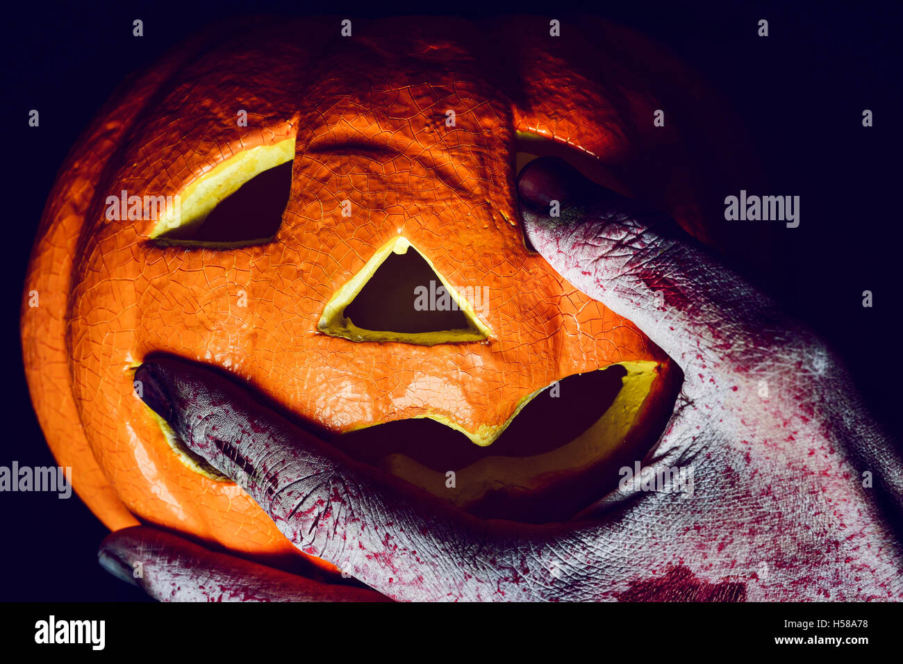 closeup of the scary hand of a monster or an undead man putting his ...
