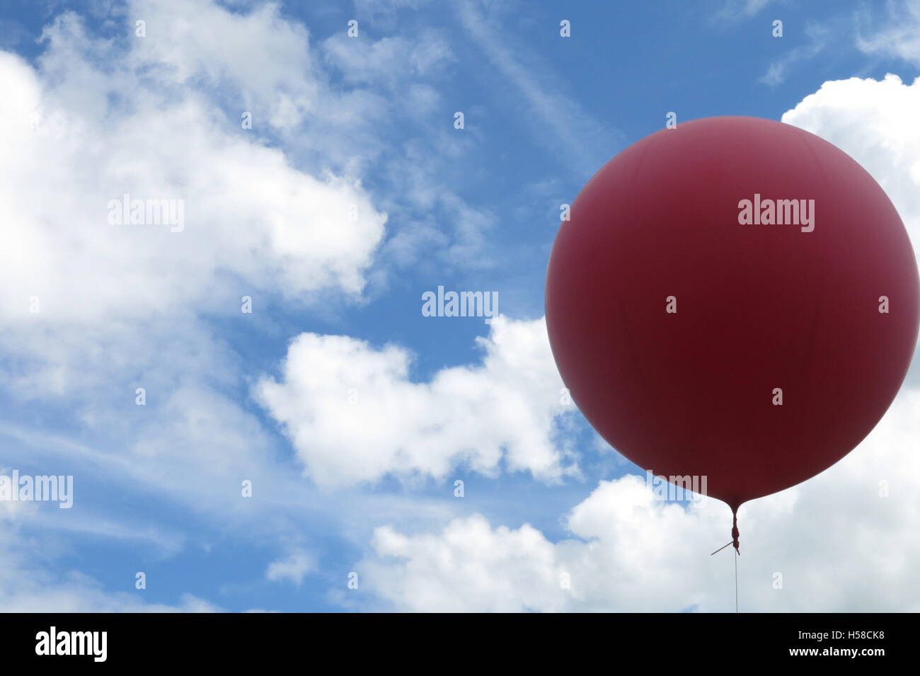 Red balloon in a summery sky Stock Photo - Alamy