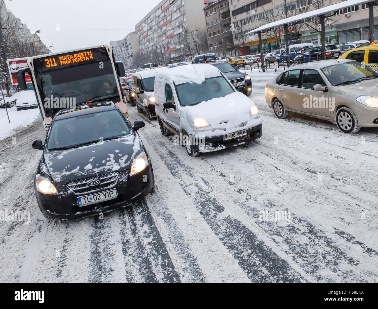 Bucharest, Romania, 5 January 2016: Vehicles are seen in traffic at a ...