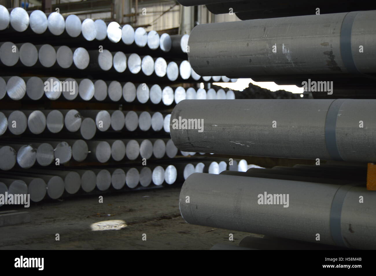 primary aluminum metal cylinders employed in the extrusion process ...