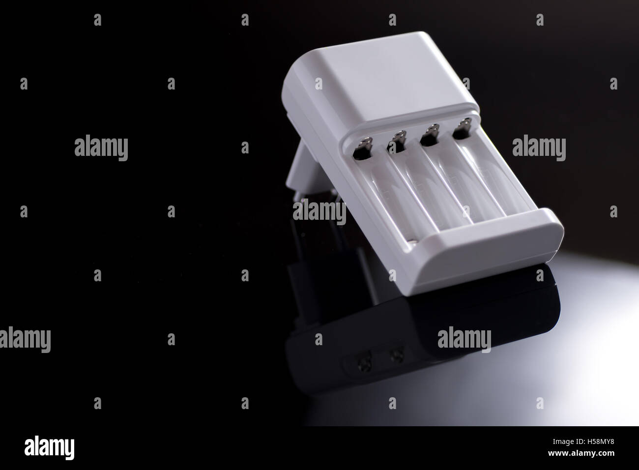 Battery Charger on Black Background Stock Photo - Alamy