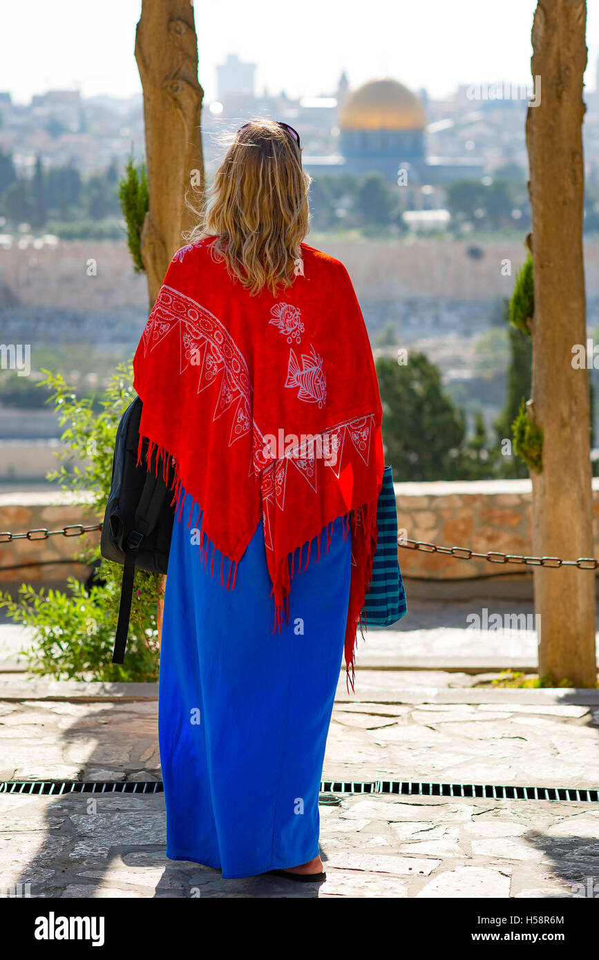 Woman tourist looks at the dome of the mosque of Jerusalem in Israel ...