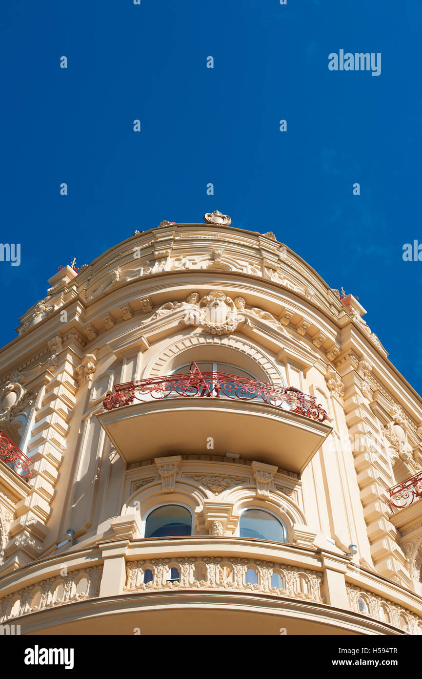 old corner building with stone balconies against a sky Stock Photo - Alamy