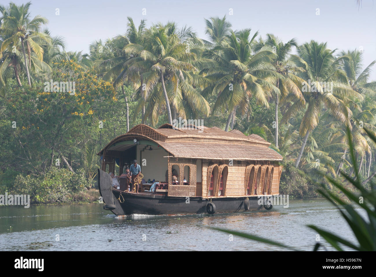 A traditional-style houseboat for western tourists shown in the Kerala ...