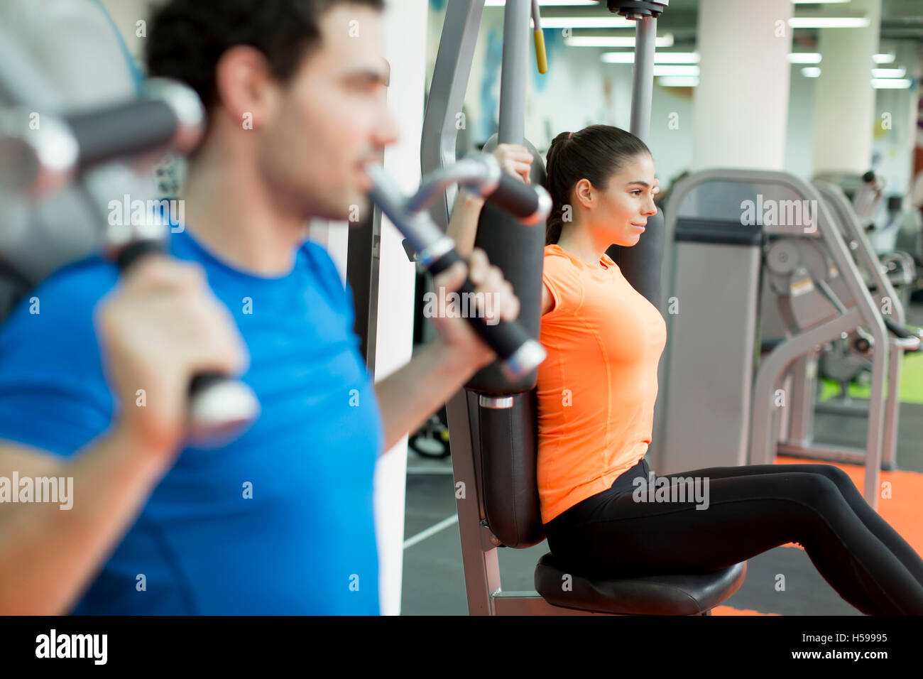 Young people doung workout in the gym Stock Photo - Alamy