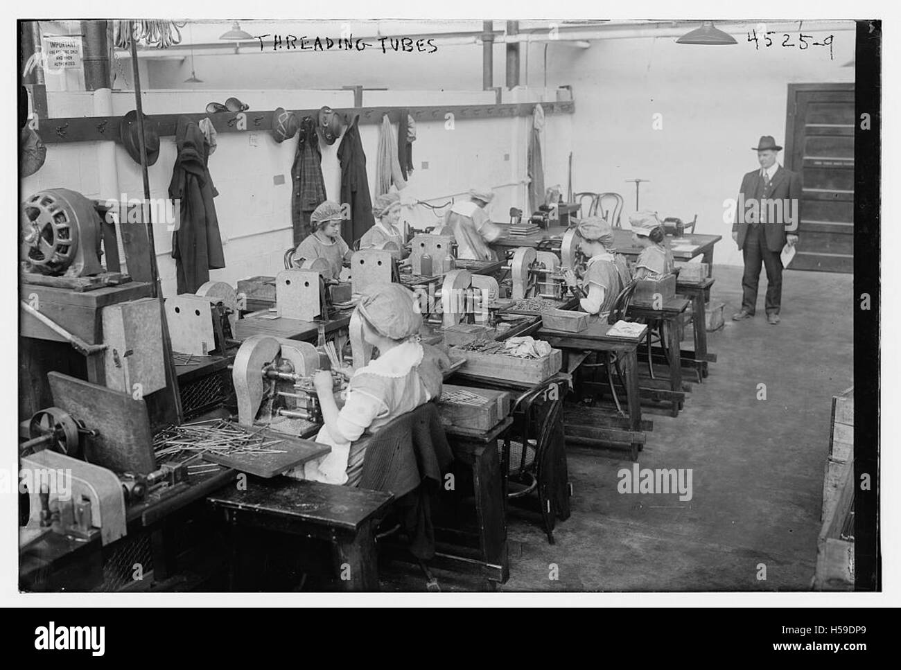 A process involving the insertion of thread into a needle or machine to ...