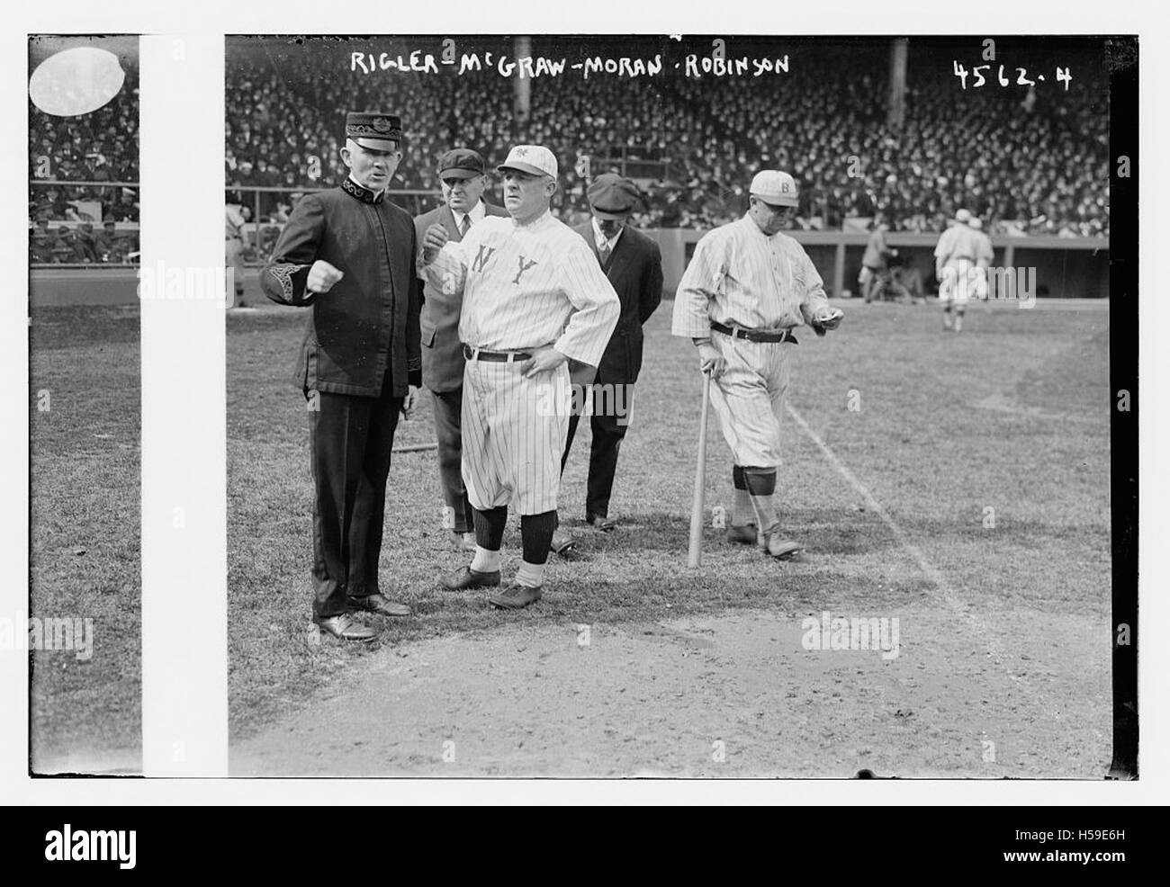 A historical image capturing Umpire Charles Cy Rigler and Manager John ...