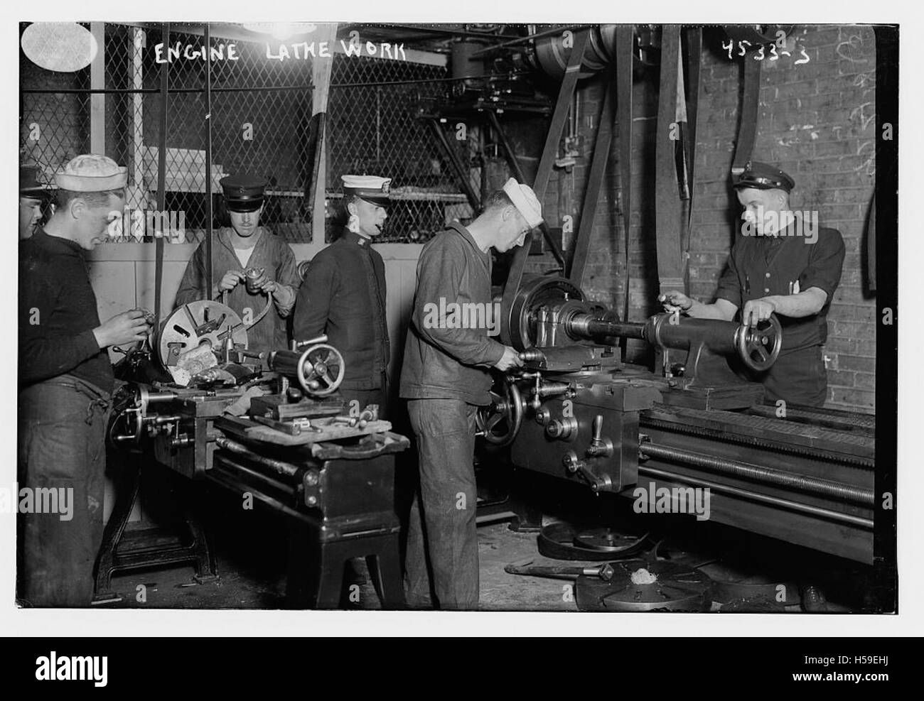 This image showcases an engine lathe, a machine tool used for shaping ...