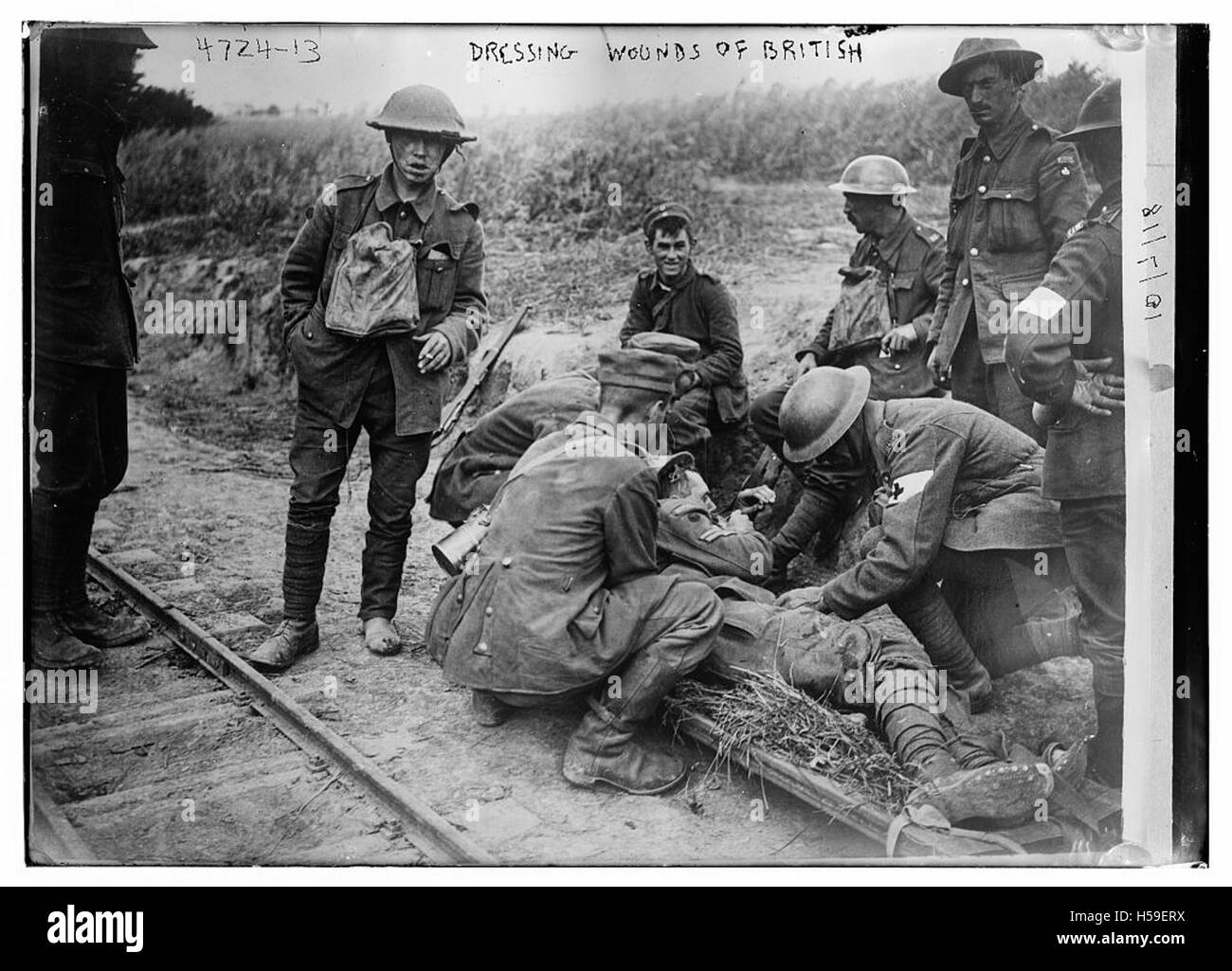 This photograph depicts medical personnel attending to wounds during a ...