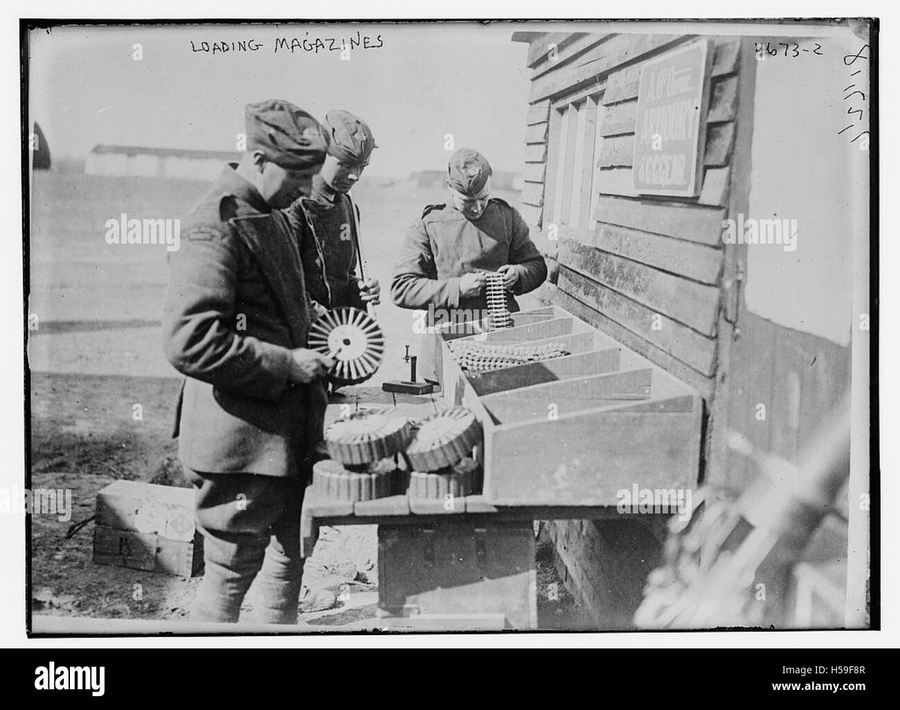 An image or event depicting the process of loading a magazine, possibly ...