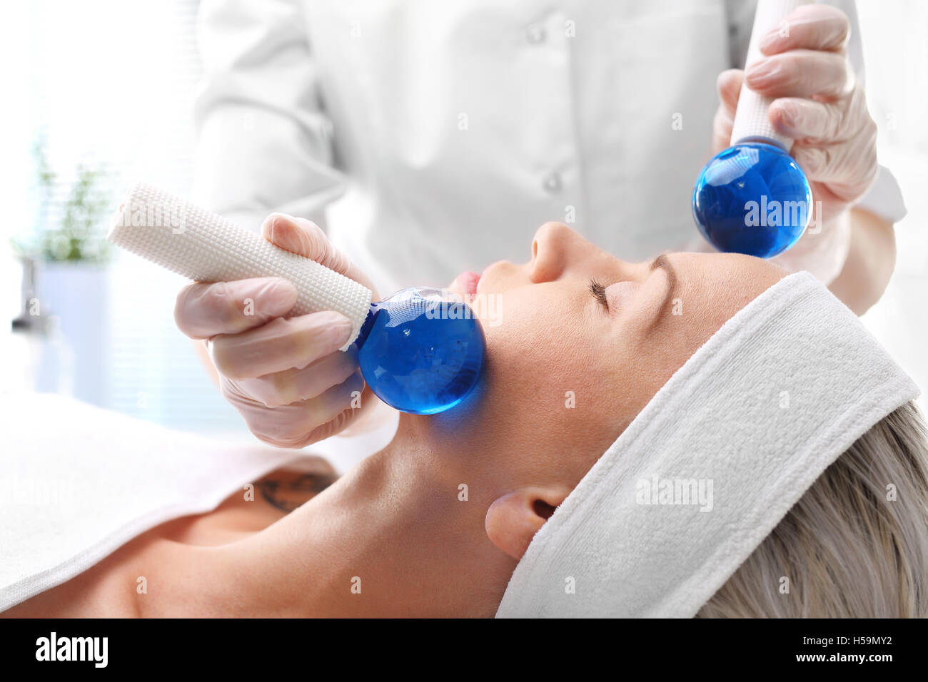 Wave roller massage. Cosmetic treatment, facial massage glass balls ...