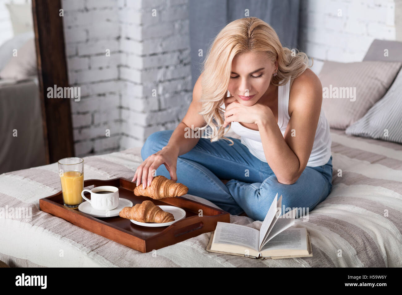 Elegant woman reading interesting book hi-res stock photography and ...