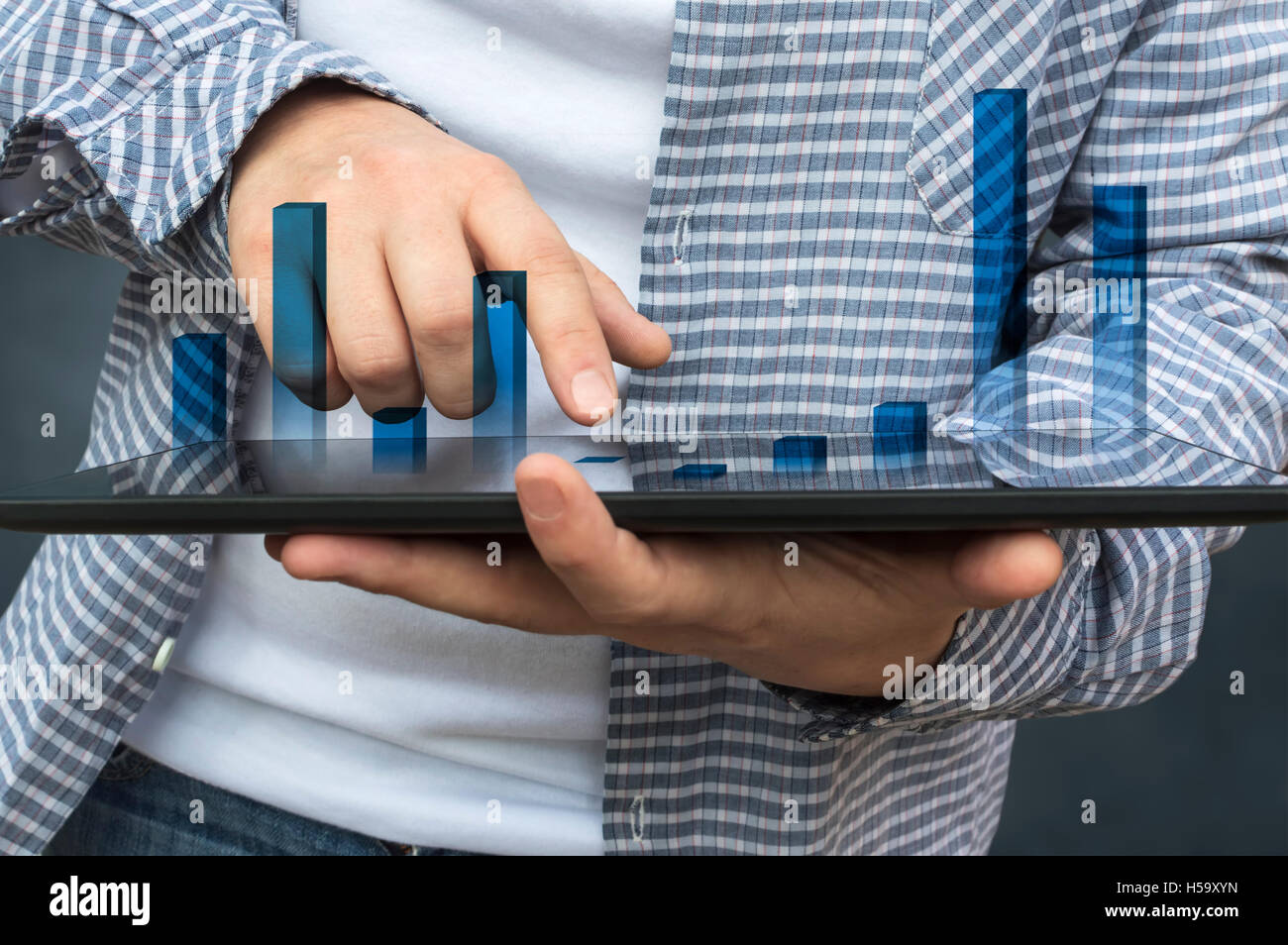Business person analyzing financial statistics displayed on the tablet ... Business person analyzing financial statistics displayed on the tablet ...