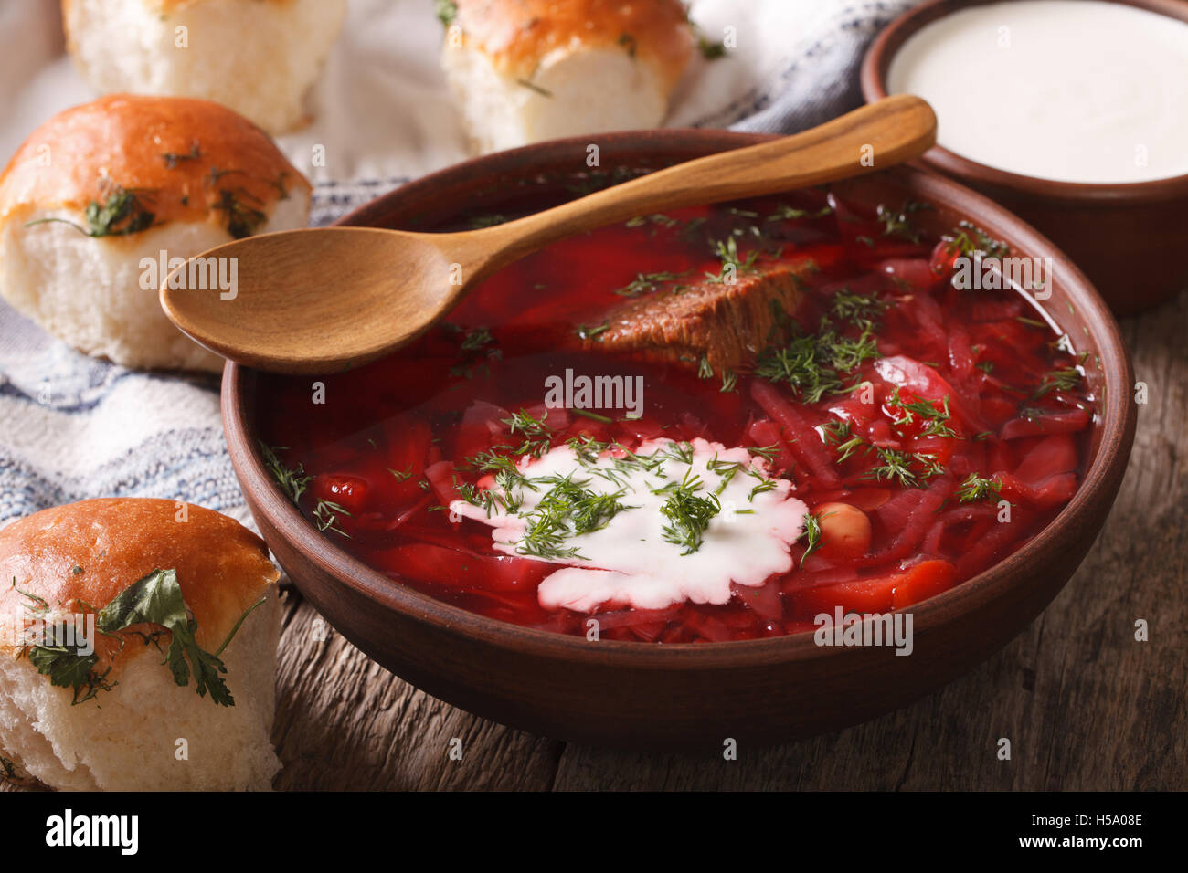 Traditional Ukrainian borsch soup close up in a bowl on the table ...