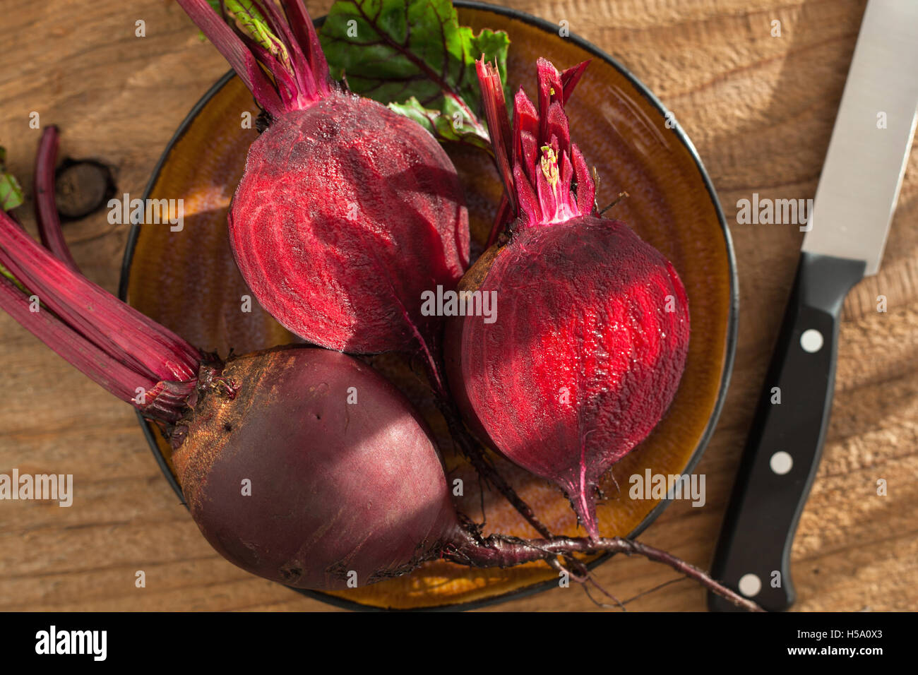 raw beetroot on wooden background Stock Photo - Alamy