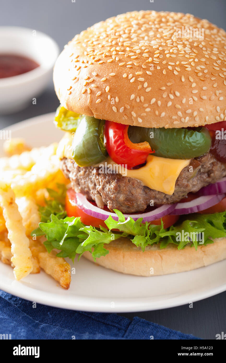 homemade cheese burger with peppers tomato onion Stock Photo - Alamy