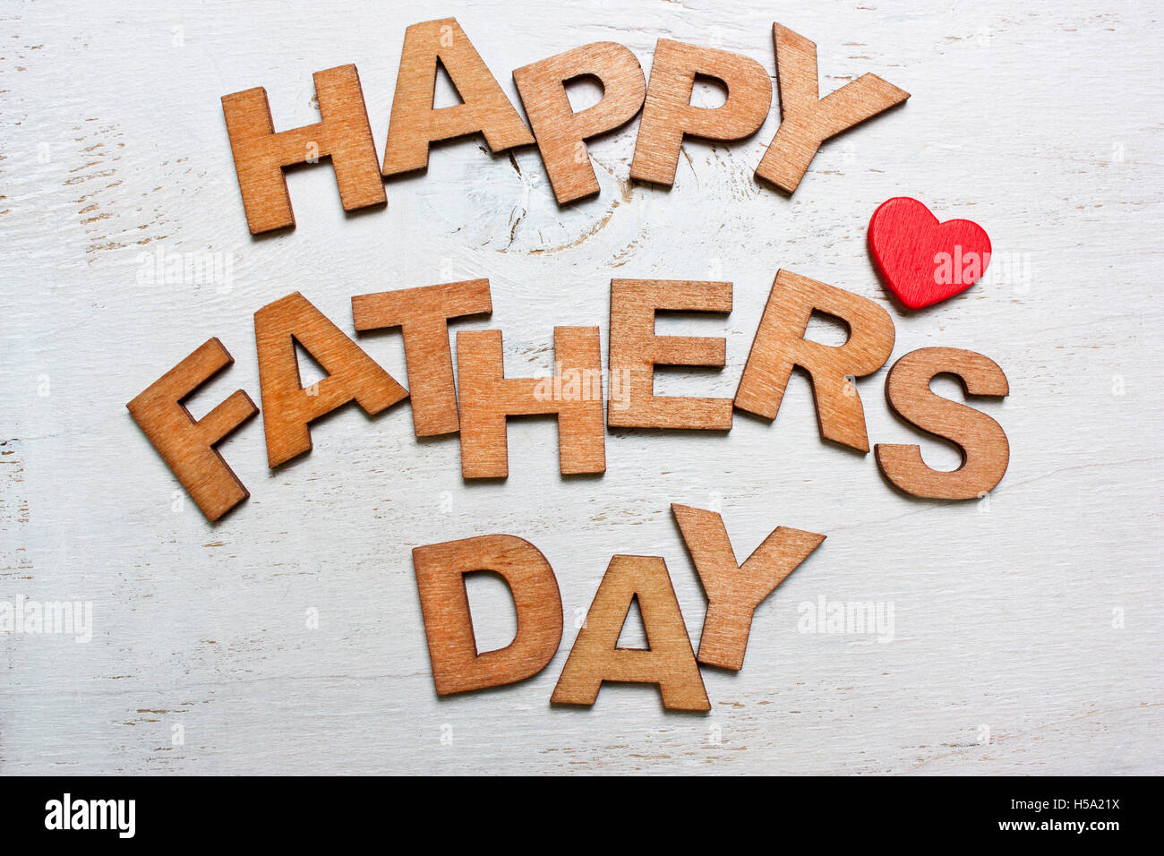Happy Fathers Day with wooden letters on an old white wooden background ...