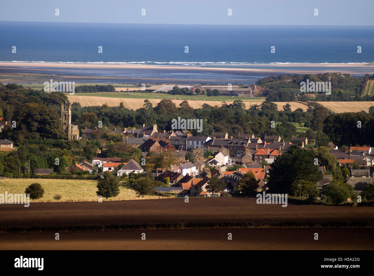 The village of Belford and Northumberland coast Stock Photo - Alamy