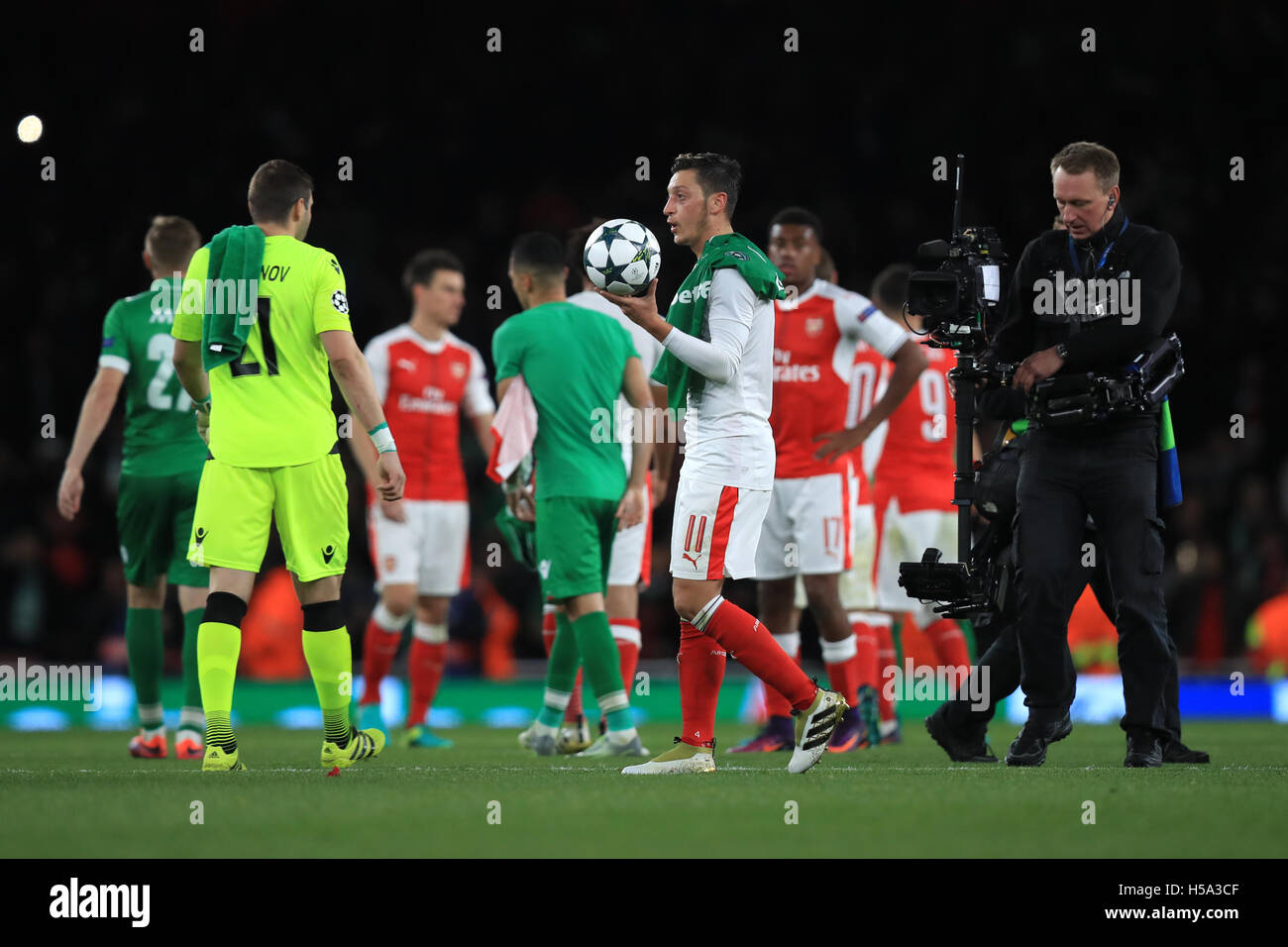 Arsenal's Mesut Ozil with the match ball after his hat-trick during the ...