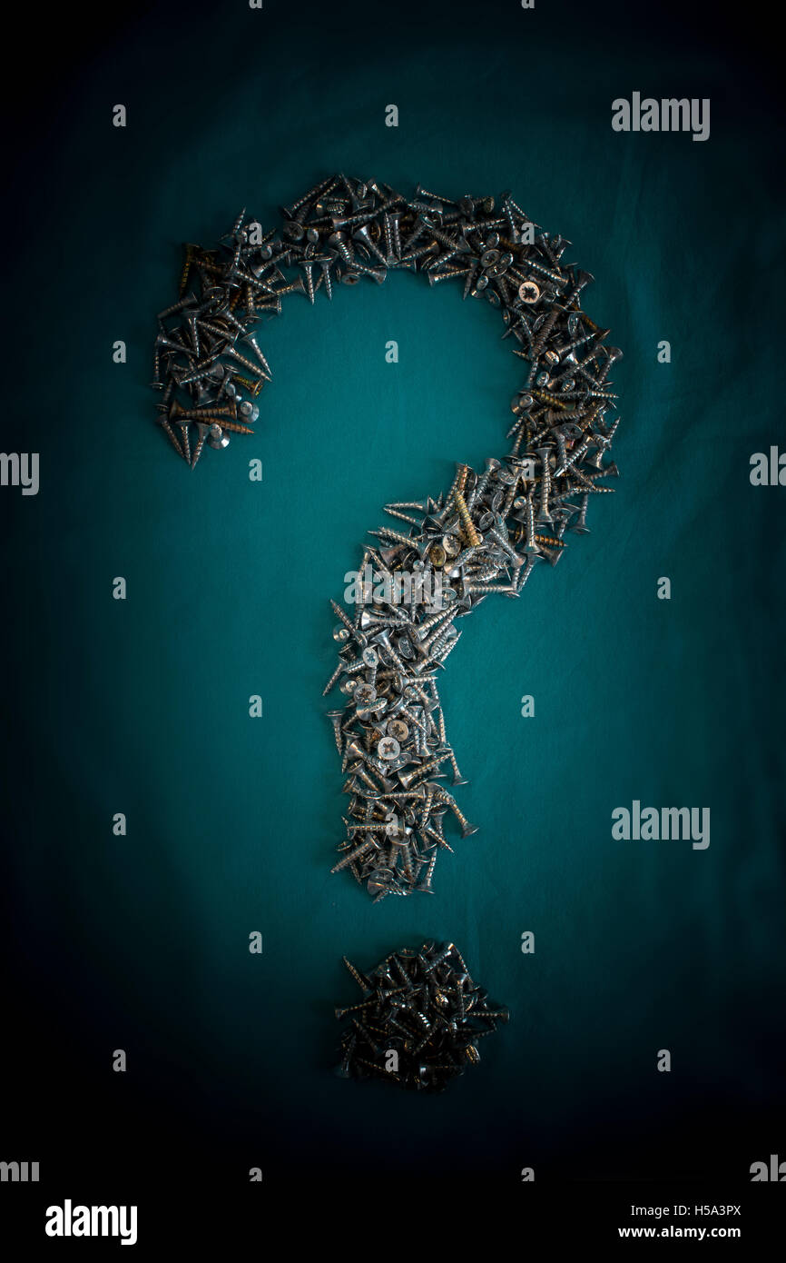 Small Twin-fast Screws lined in shape of Question Mark on dark ...