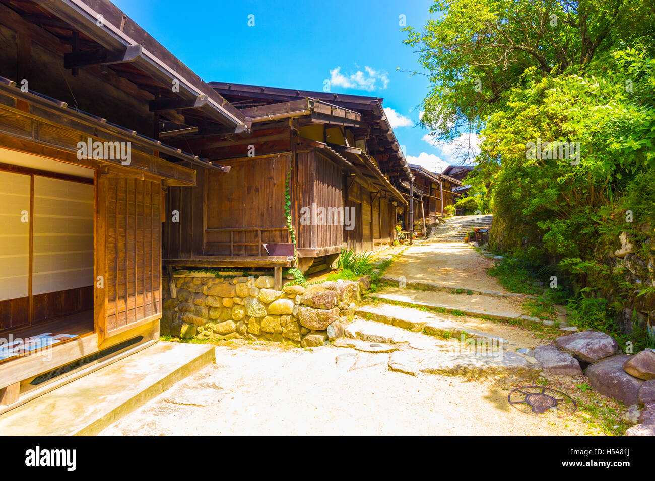 A series of bucolic wooden houses and dirt road restored to an old ...