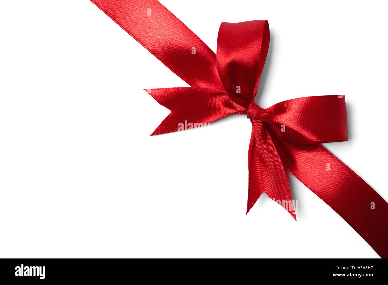 Red ribbon bow on white background Stock Photo - Alamy