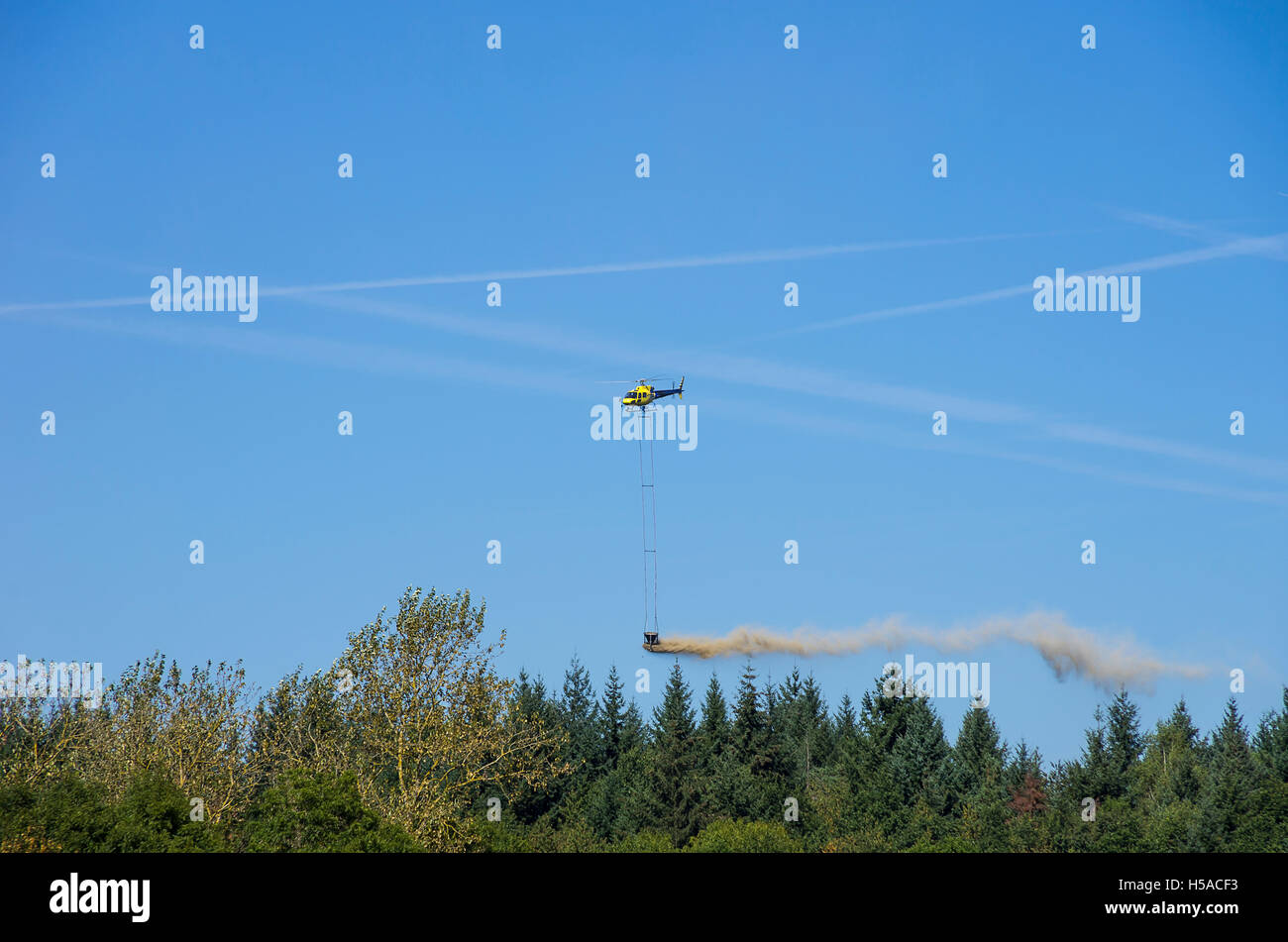 A helicopter sprays chemical substances Stock Photo - Alamy