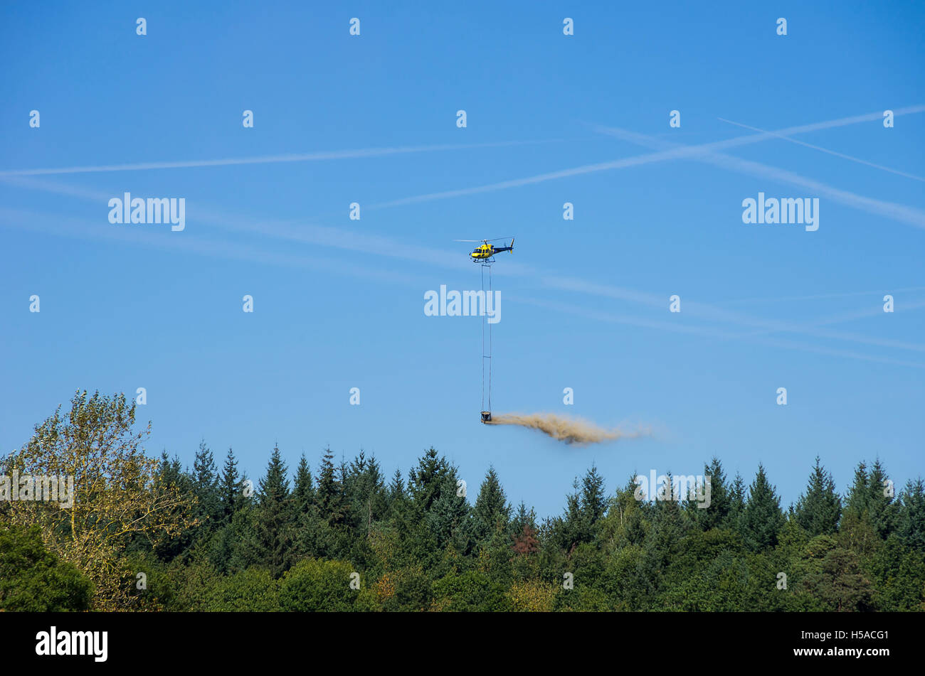 A helicopter sprays chemical substances Stock Photo - Alamy