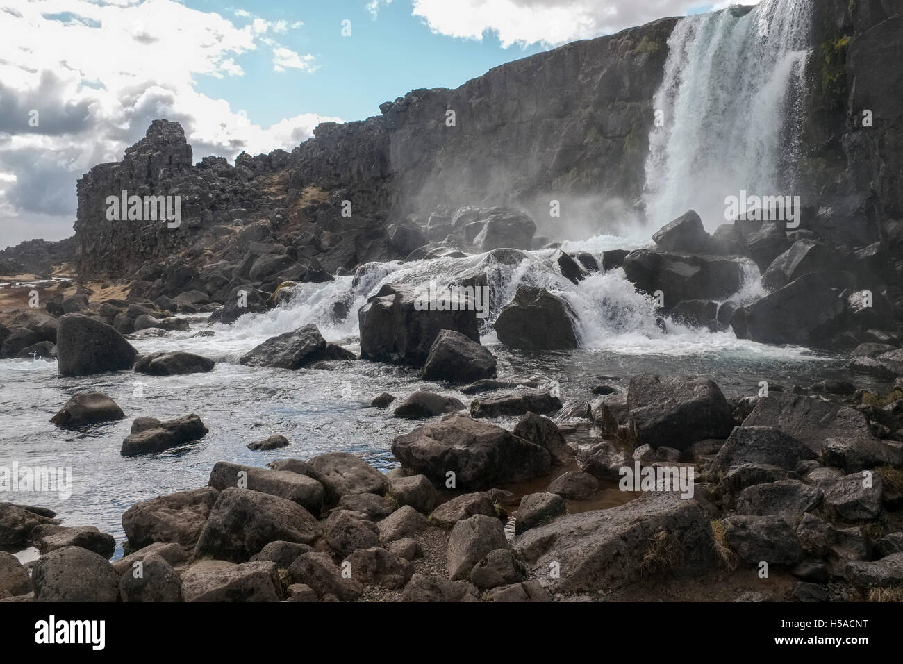 Large rocks and waterfall Stock Photo - Alamy